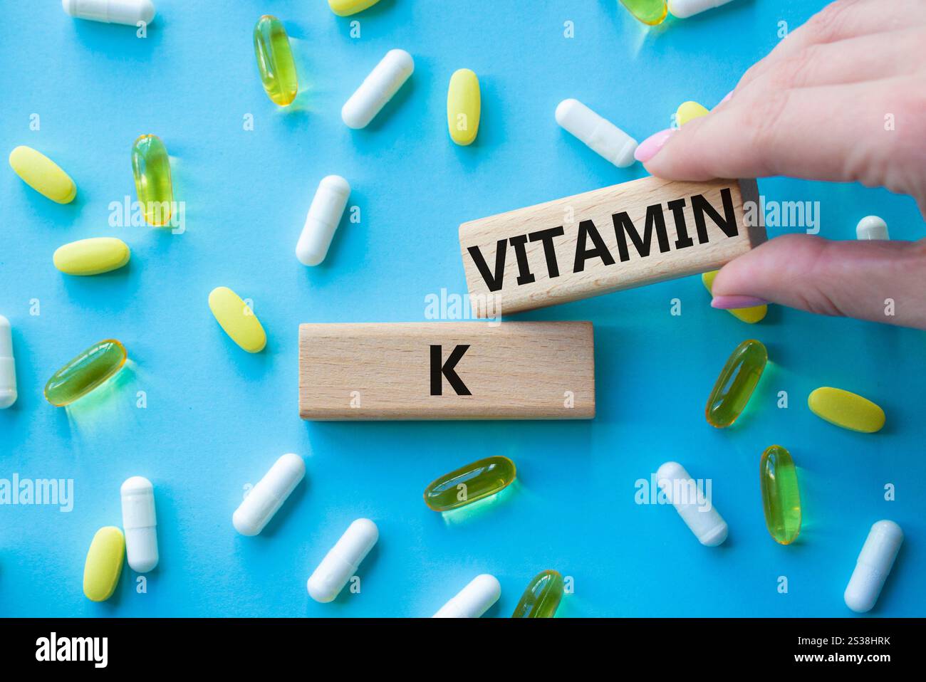 Vitamin K symbol. Concept word Vitamin K on wooden blocks. Beautiful ...