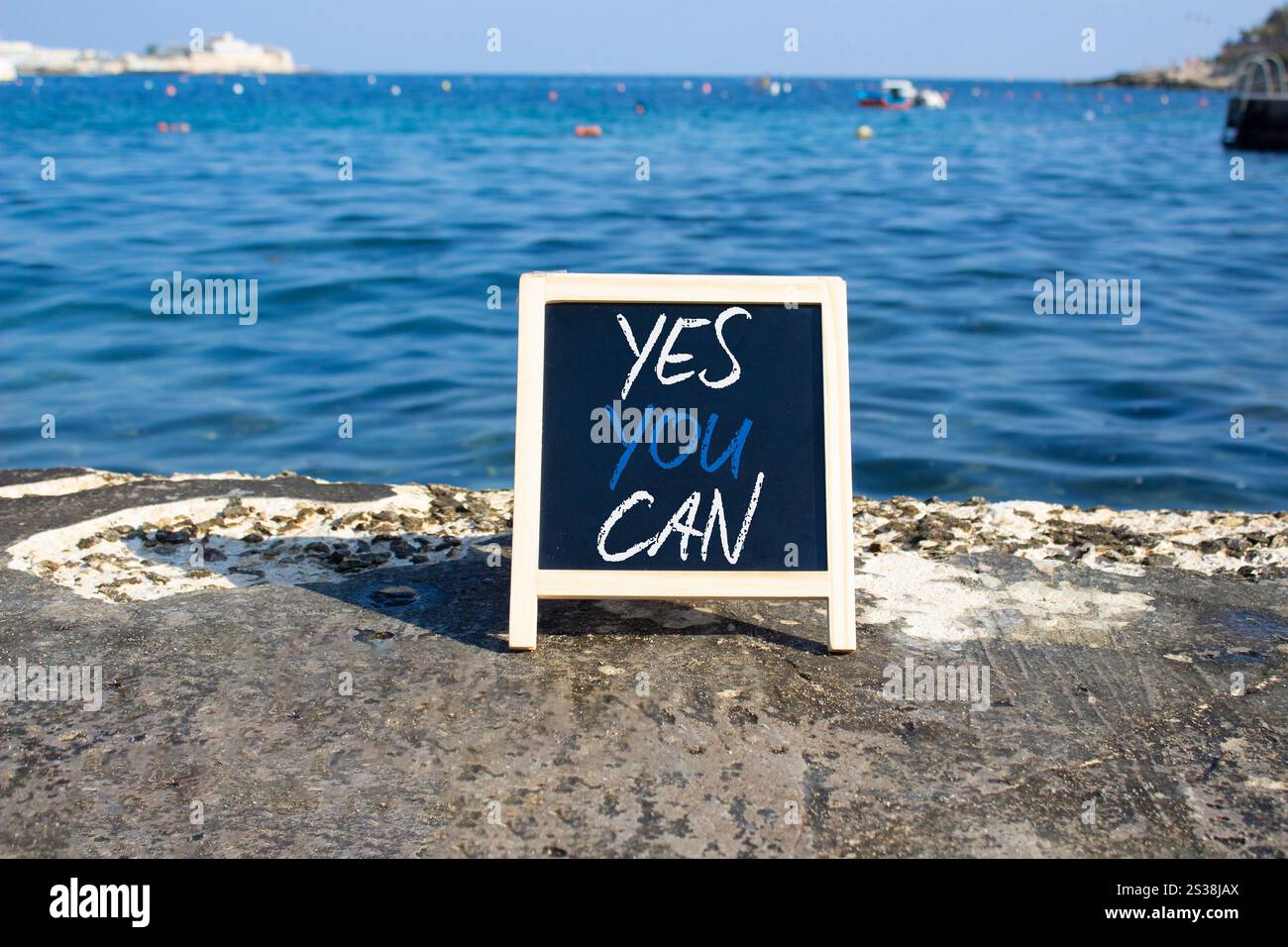 Yes You Can symbol. Concept words Yes You Can on black chalk blackboard ...