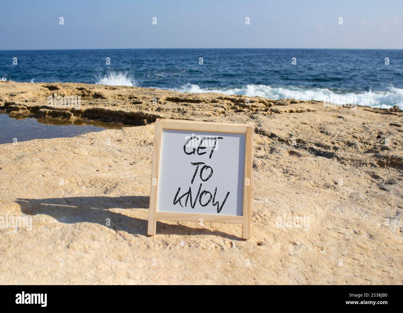 Get to Know symbol. White Blackboard with words Get to Know. Beautiful ...