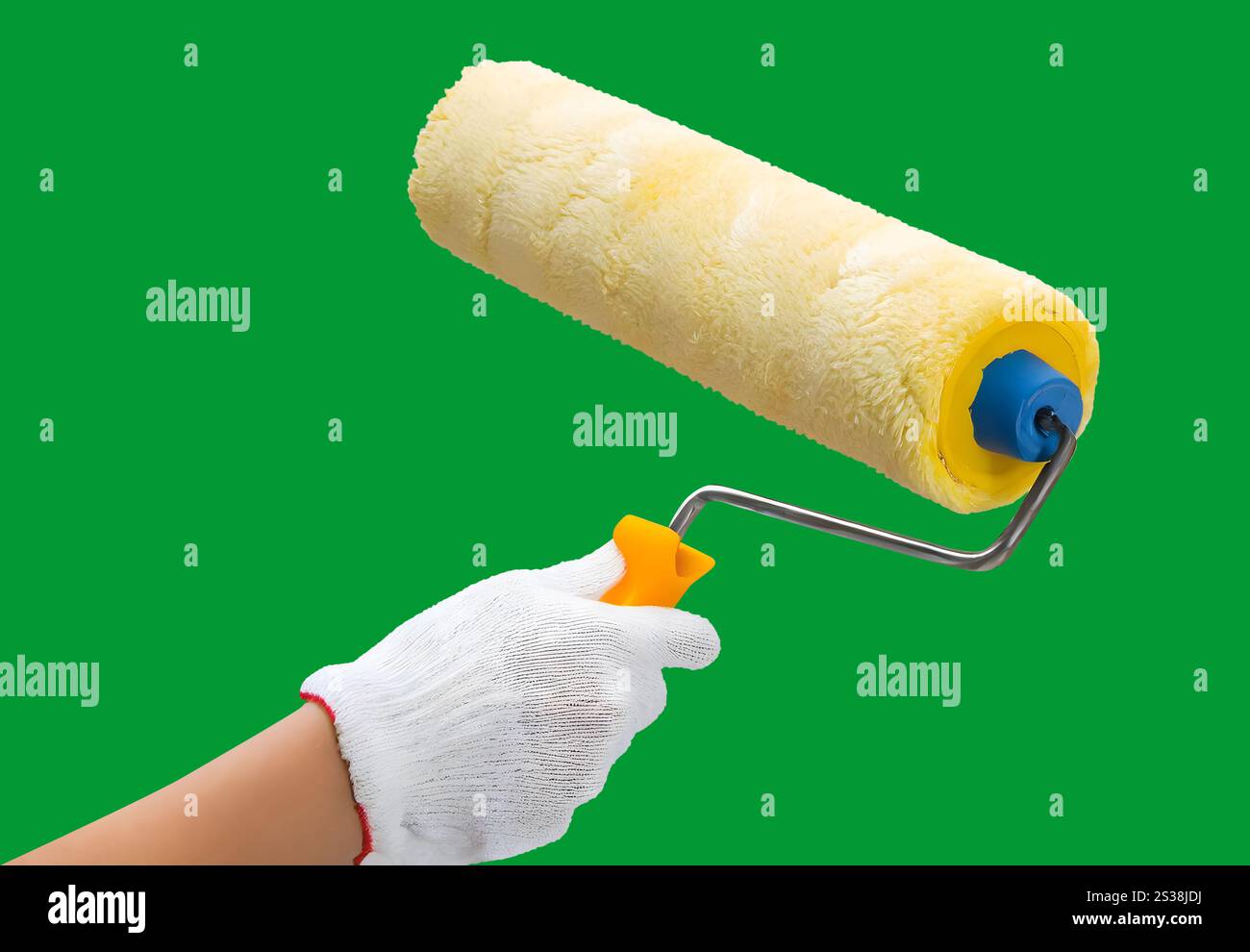 A person gracefully uses a roller to apply paint to a wall, creating ...