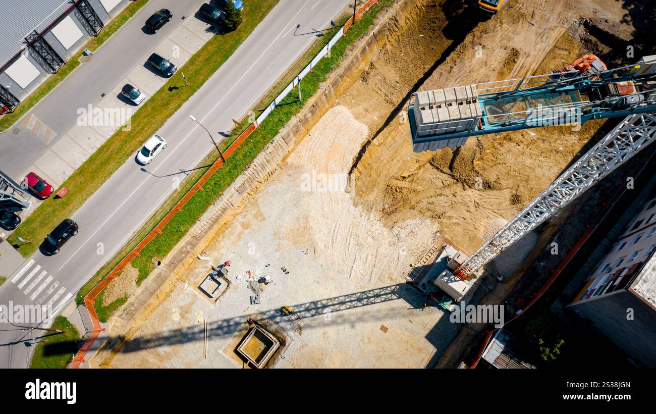 Above view on two excavators as digging, excavating foundation for ...