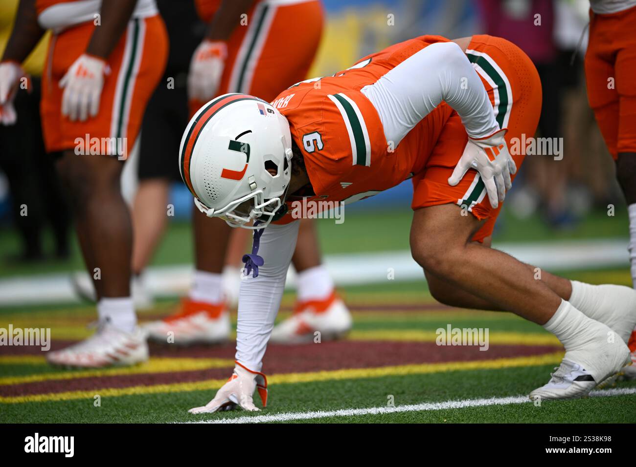 Miami defensive lineman Tyler Baron (9) warms up before the Pop Tarts ...