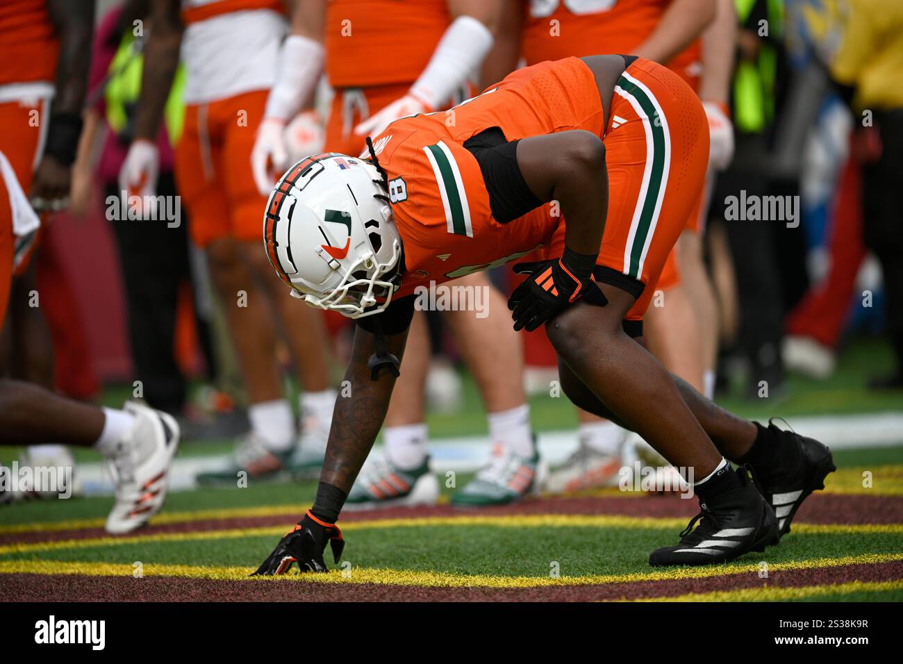 Miami defensive lineman Josh Horton (8) warms up before the Pop Tarts ...