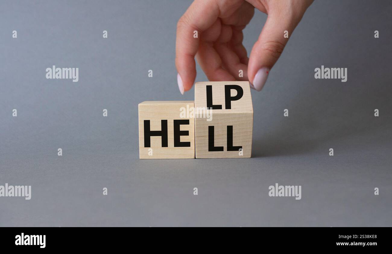 Help vs Hell symbol. Businessman hand Turnes cube and changes word Hell ...