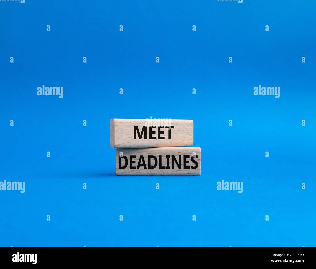 Meet Deadlines symbol. Concept word Meet Deadlines on wooden blocks ...