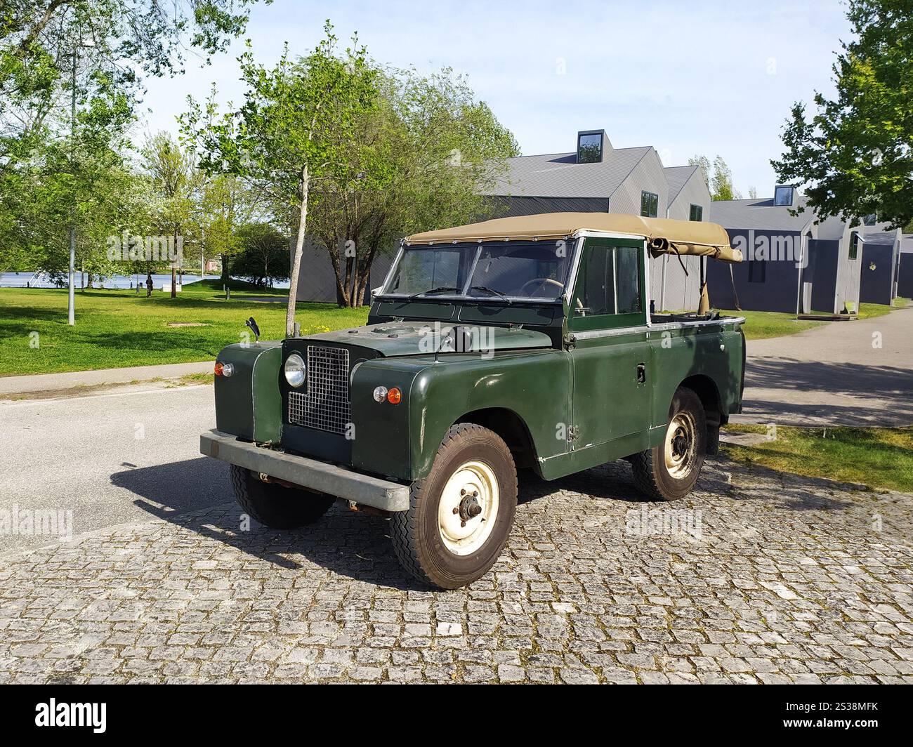 Green classic old SUV. Vintage car against the backdrop of nature ...