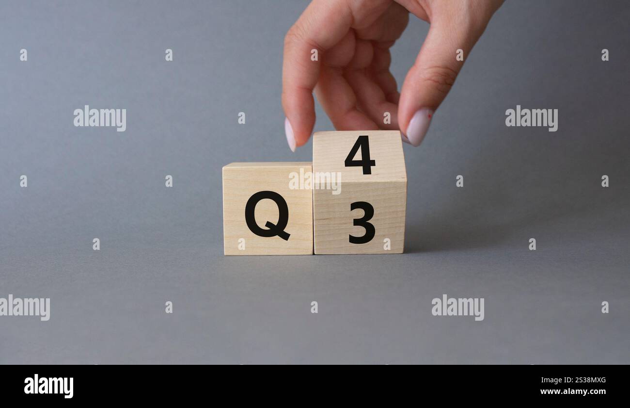 From 3rd Quarter to 4th symbol. Businessman hand Turnes cube and ...