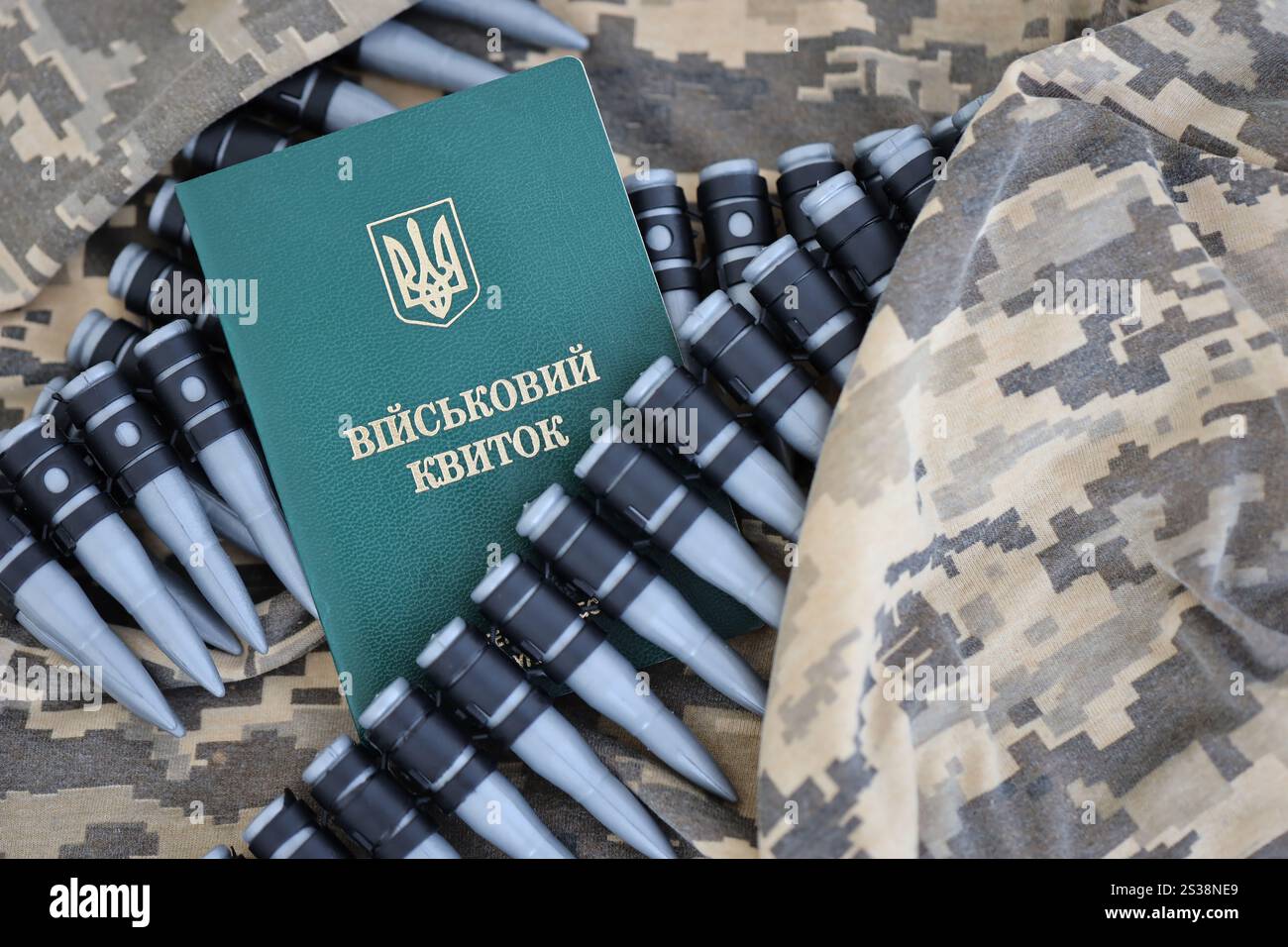 Ukrainian military ID on fabric with texture of pixeled camouflage ...