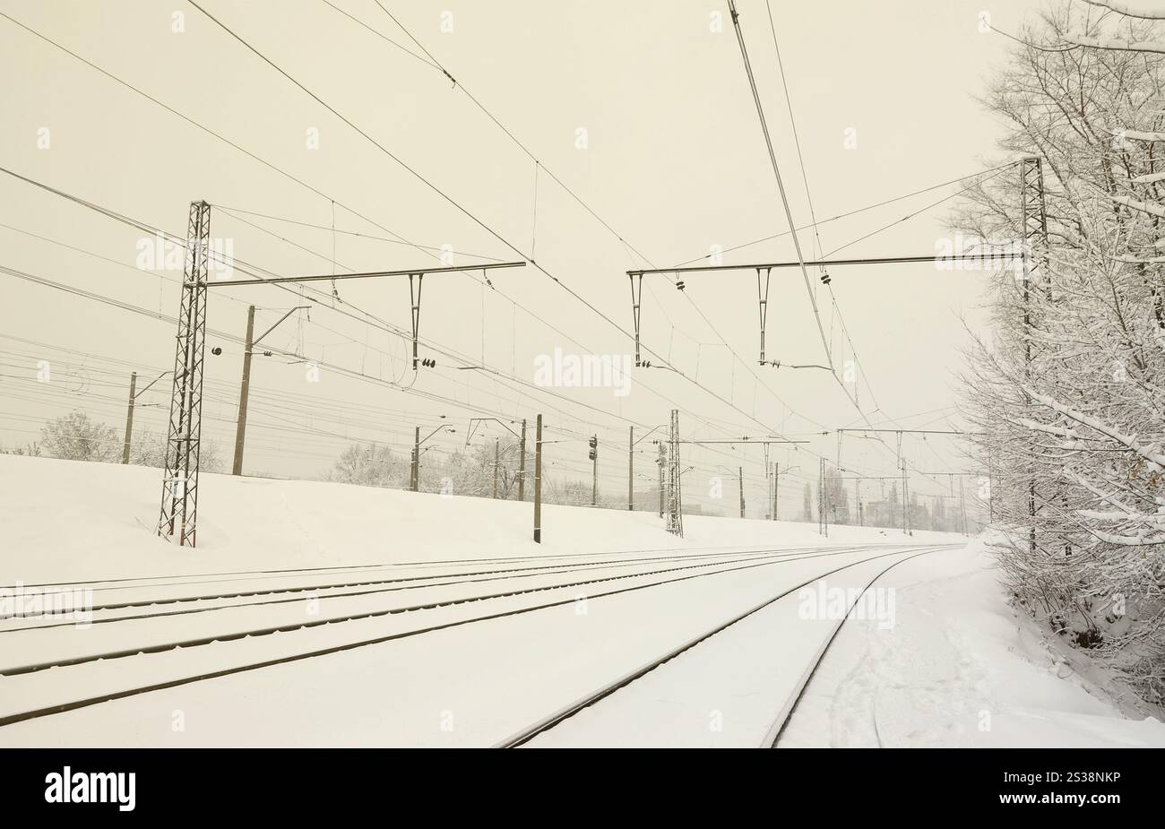 Winter railway landscape, Railway tracks in the snow-covered industrial ...
