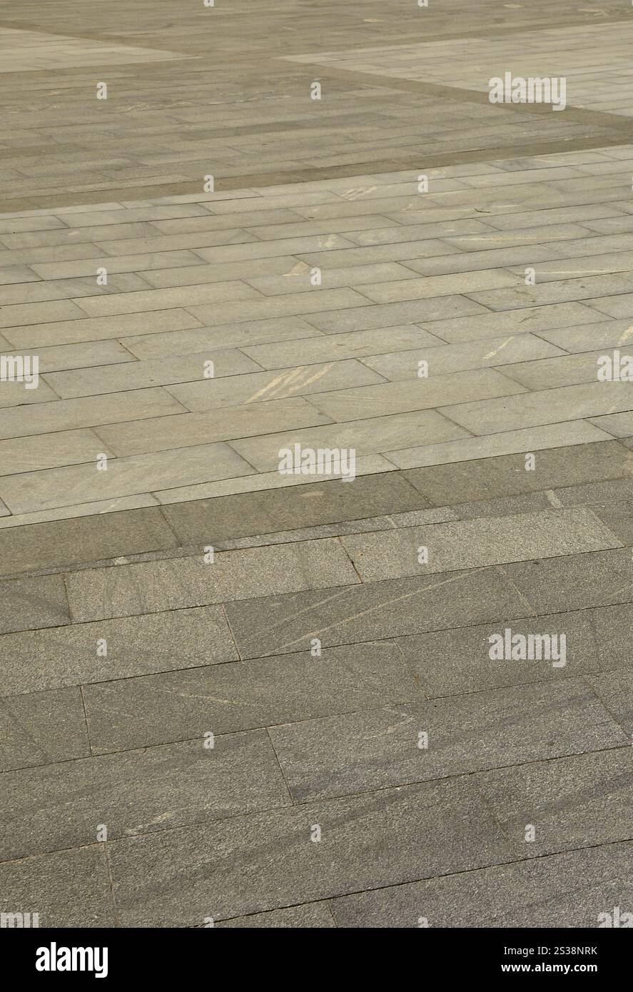 The texture of granite paving tiles from a variety of square shaped ...