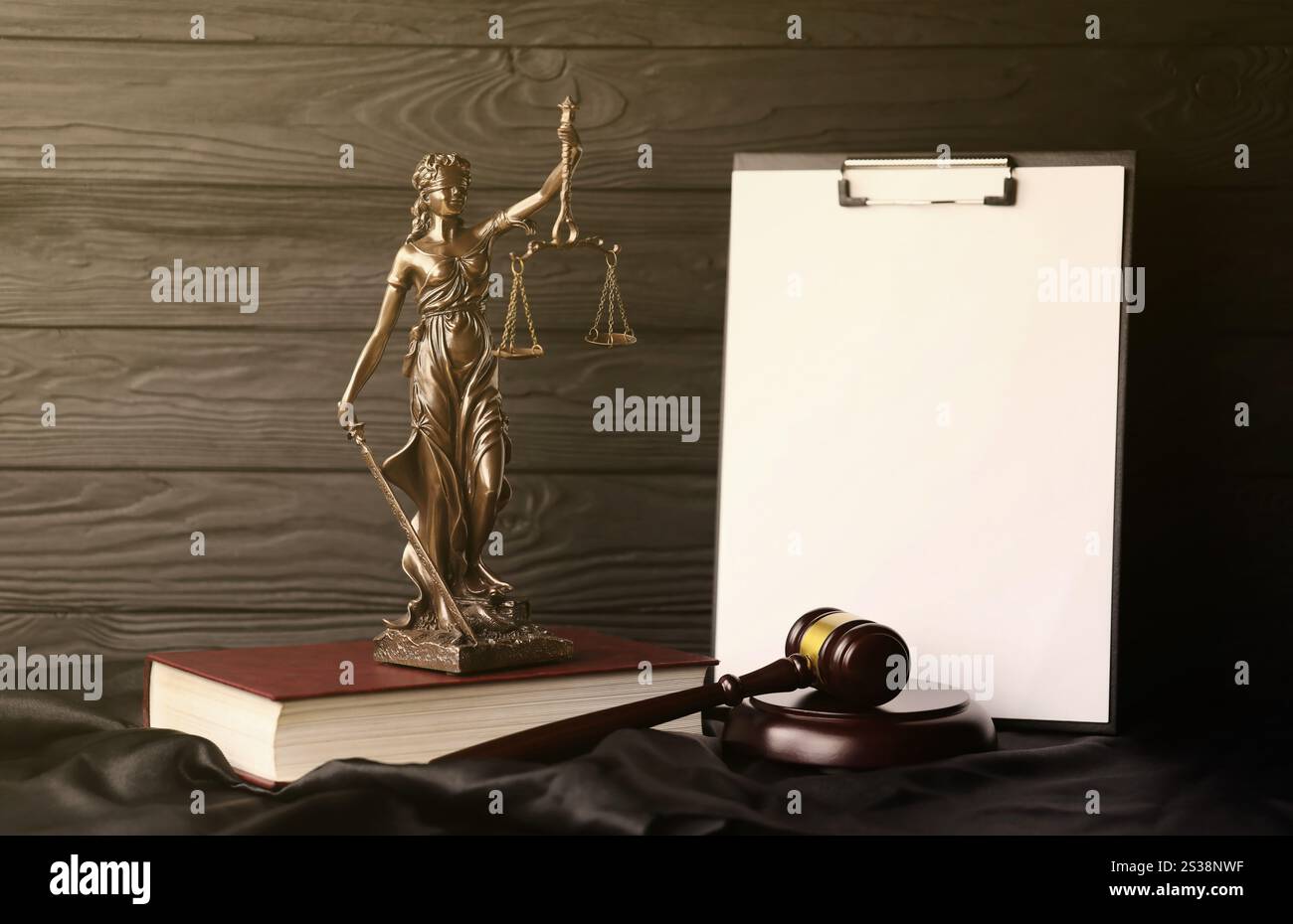 Lady justice or justitia the Roman goddess of Justice. Statue on brown ...