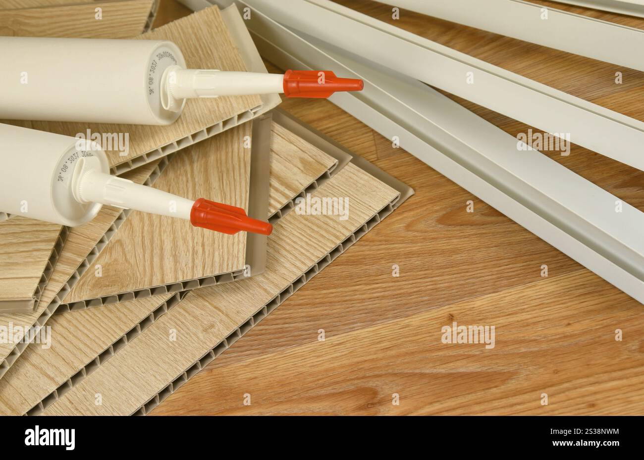 Set of items for PVC ceiling indoor works. Assembly adhesive bottles ...