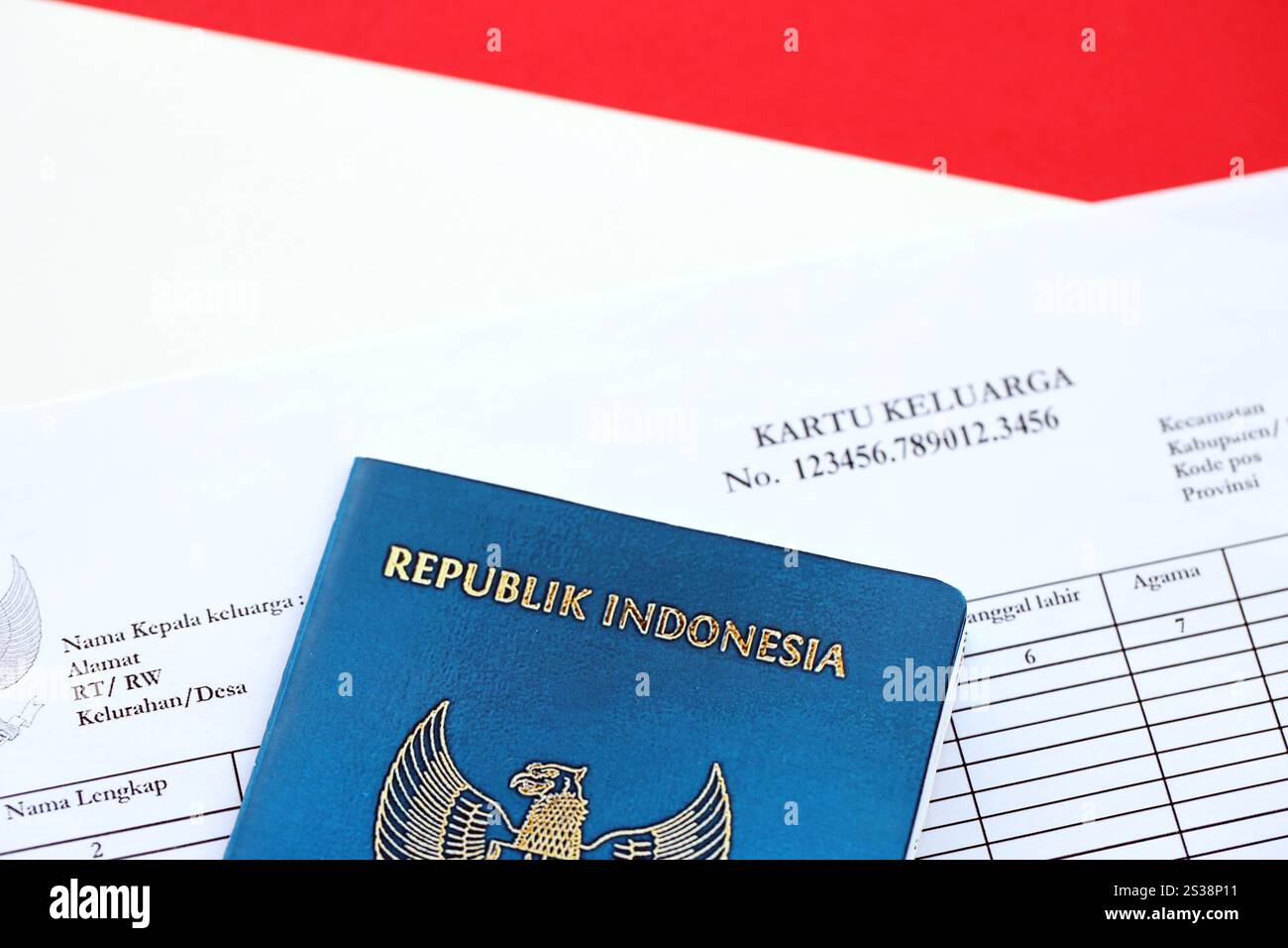 Kartu keluarga Family Identity Card with indonesian passport close up ...