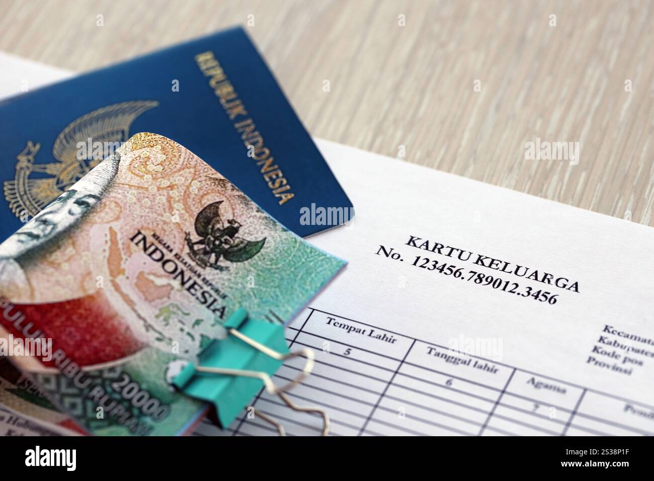 Kartu keluarga Family Identity Card with indonesian passport and bunch ...