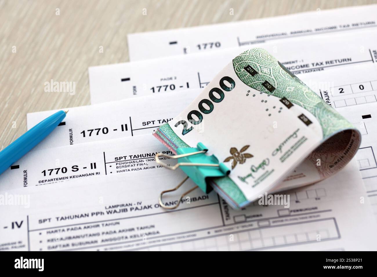 Annual Individual Income Tax Return forms with pen and indonesian ...