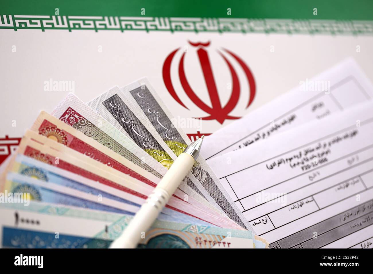 Iranian annual income tax return form F20-25-006 ready to fill on table ...