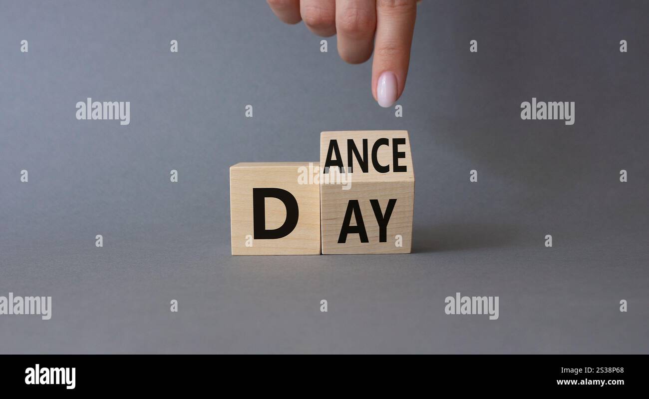 International Dance Day symbol. Businessman hand points at turned ...