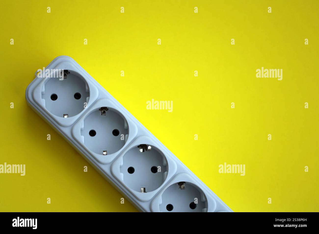 White electrical multi plug extender with european socket on bright ...