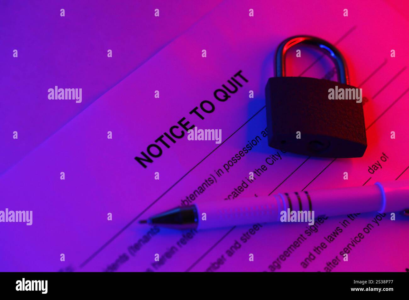 Notice to quit blank form with pen and small padlock on office table ...