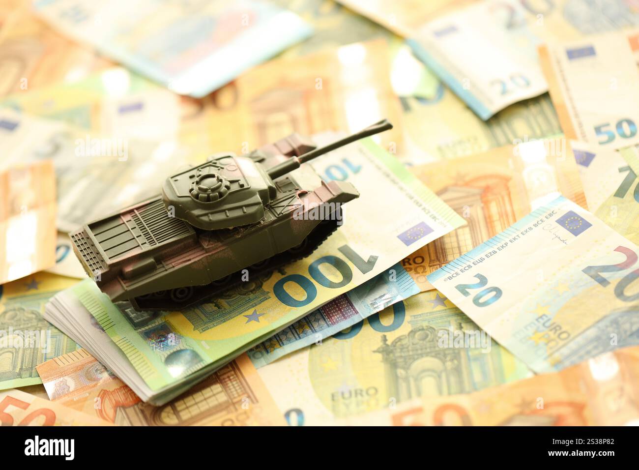 Many euro banknotes and tank. Lot of bills of European union currency ...