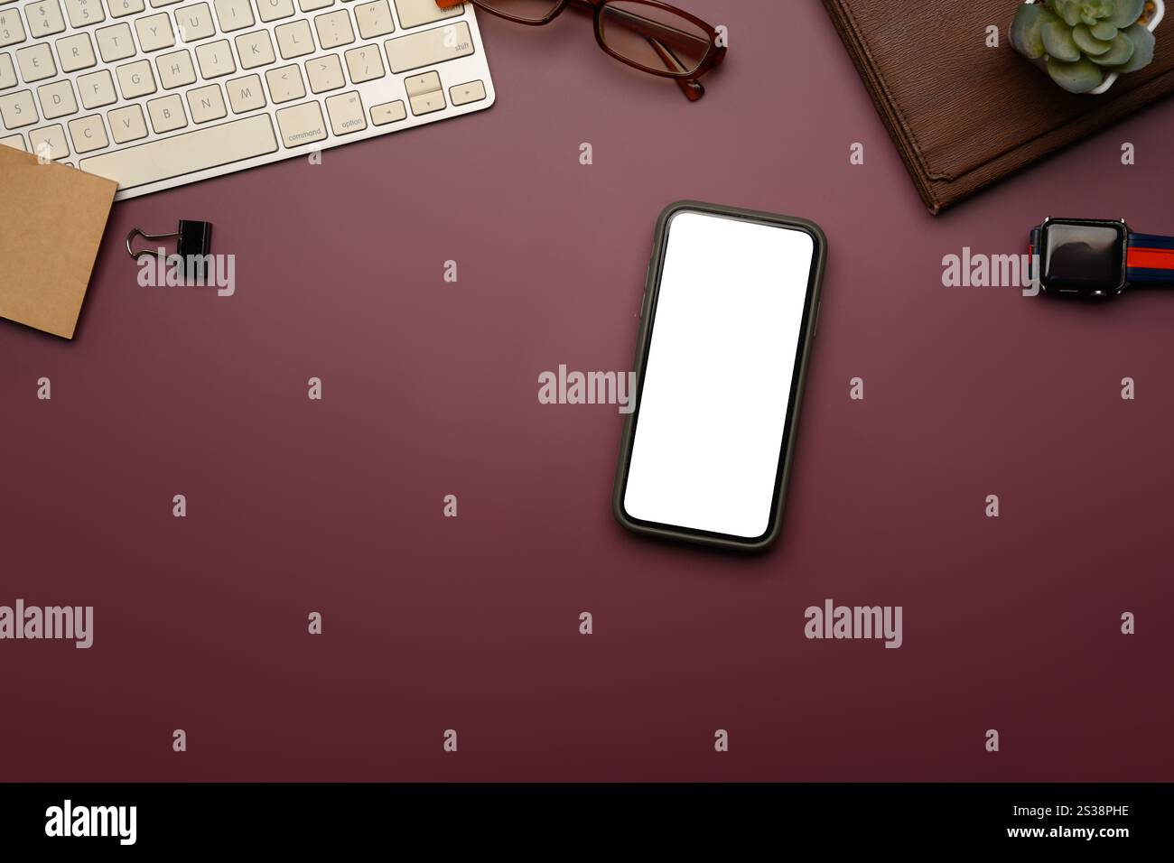 Modern workspace smartphone with blank screen, keyboard, glasses and ...