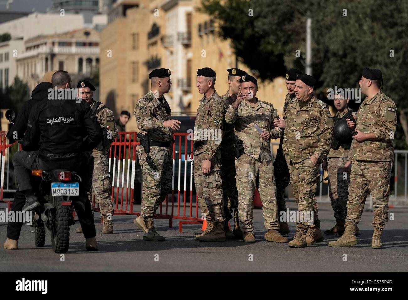 Lebanese army soldiers block a road that leads to the parliament ...