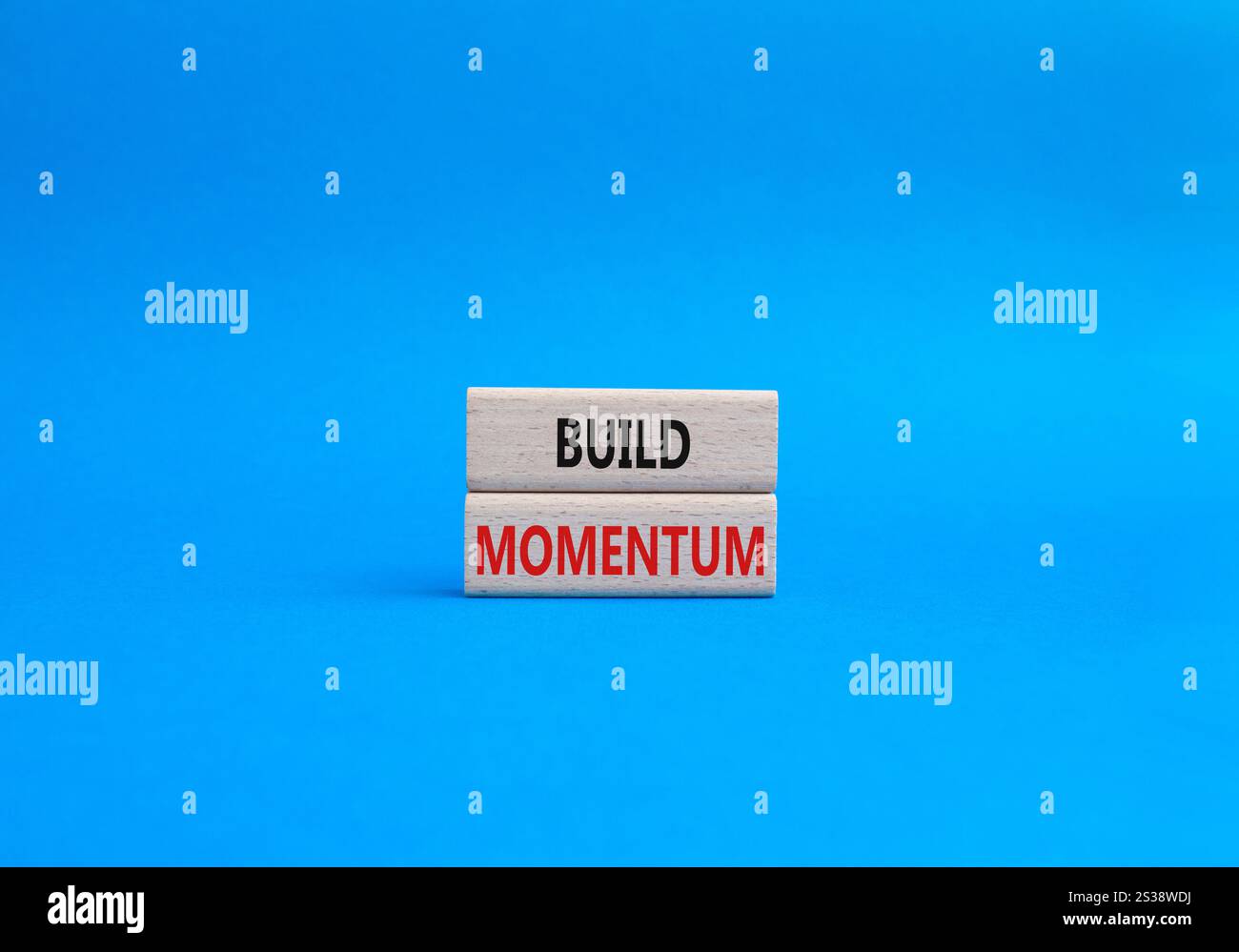 Build momentum symbol. Wooden blocks with words Build momentum ...