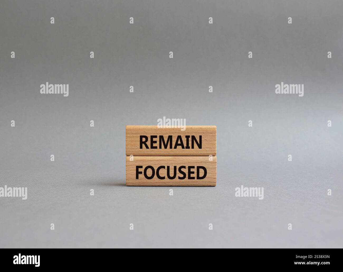 Remain focused symbol. Concept words Remain focused on wooden blocks ...