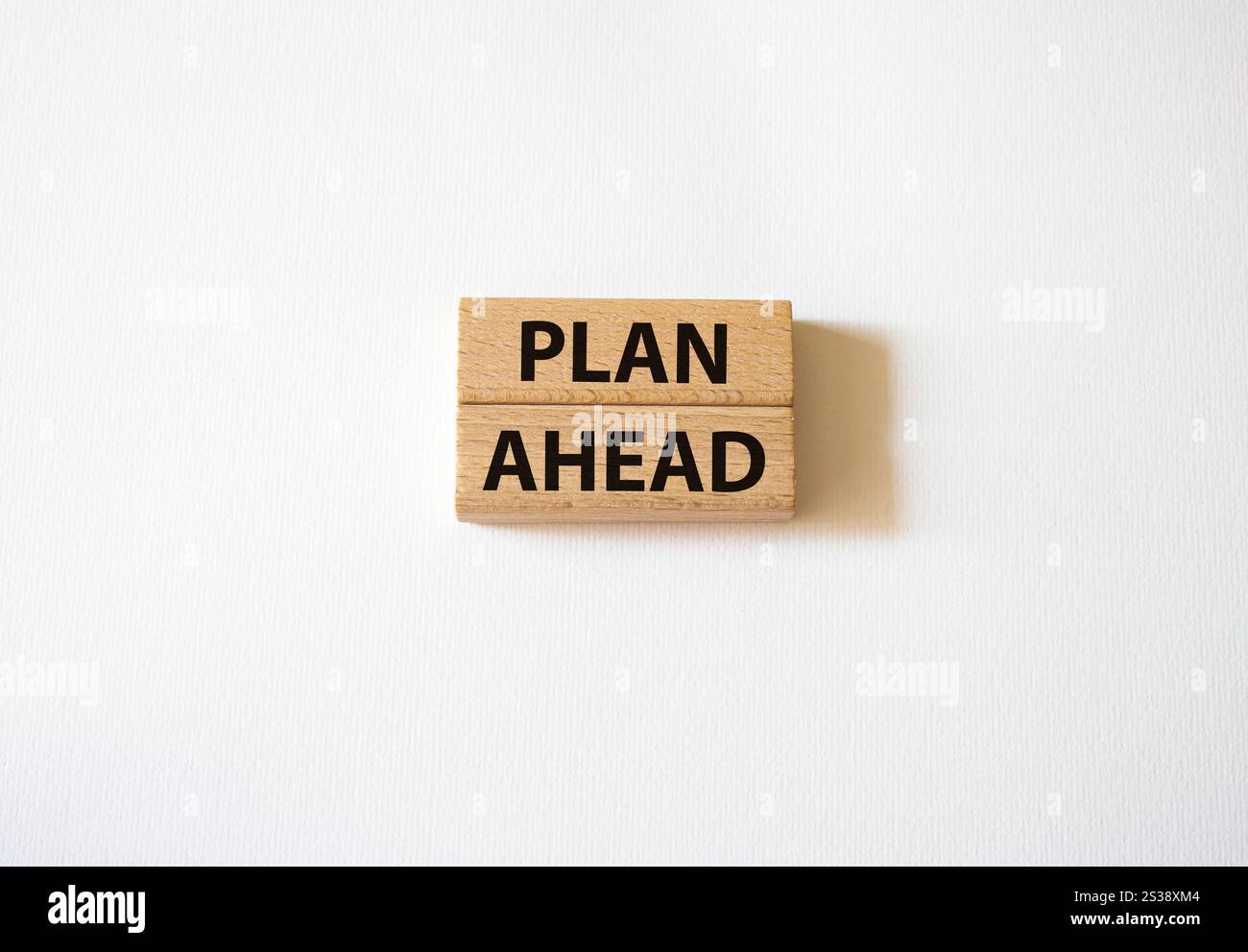 Plan ahead symbol. Wooden blocks with words Plan ahead. Beautiful white ...