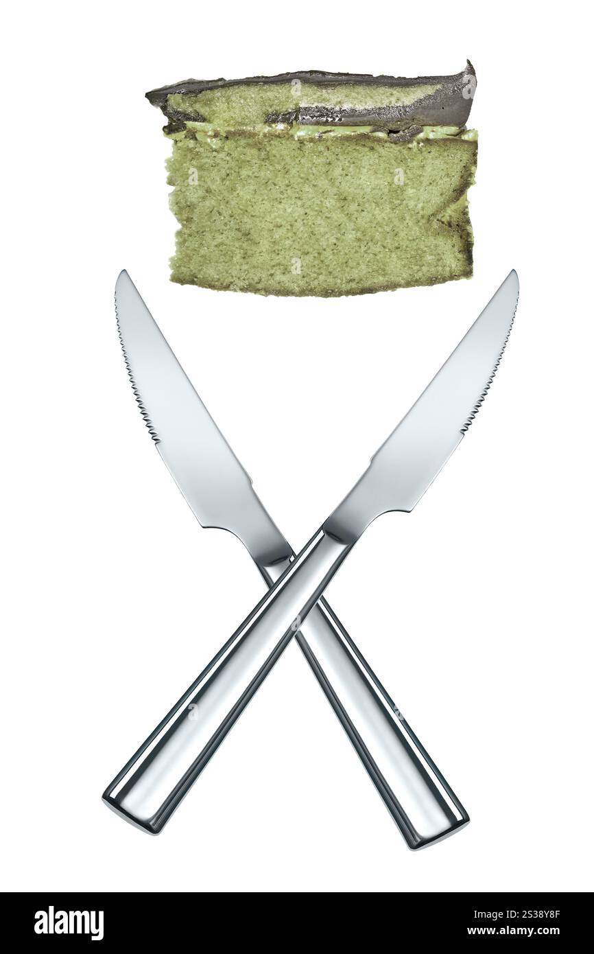 Isolated matcha layered cake with two elegant knives crossed beneath it ...