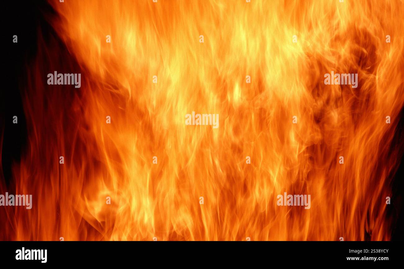 Vibrant and intense blazing fire texture background with fiery flames ...