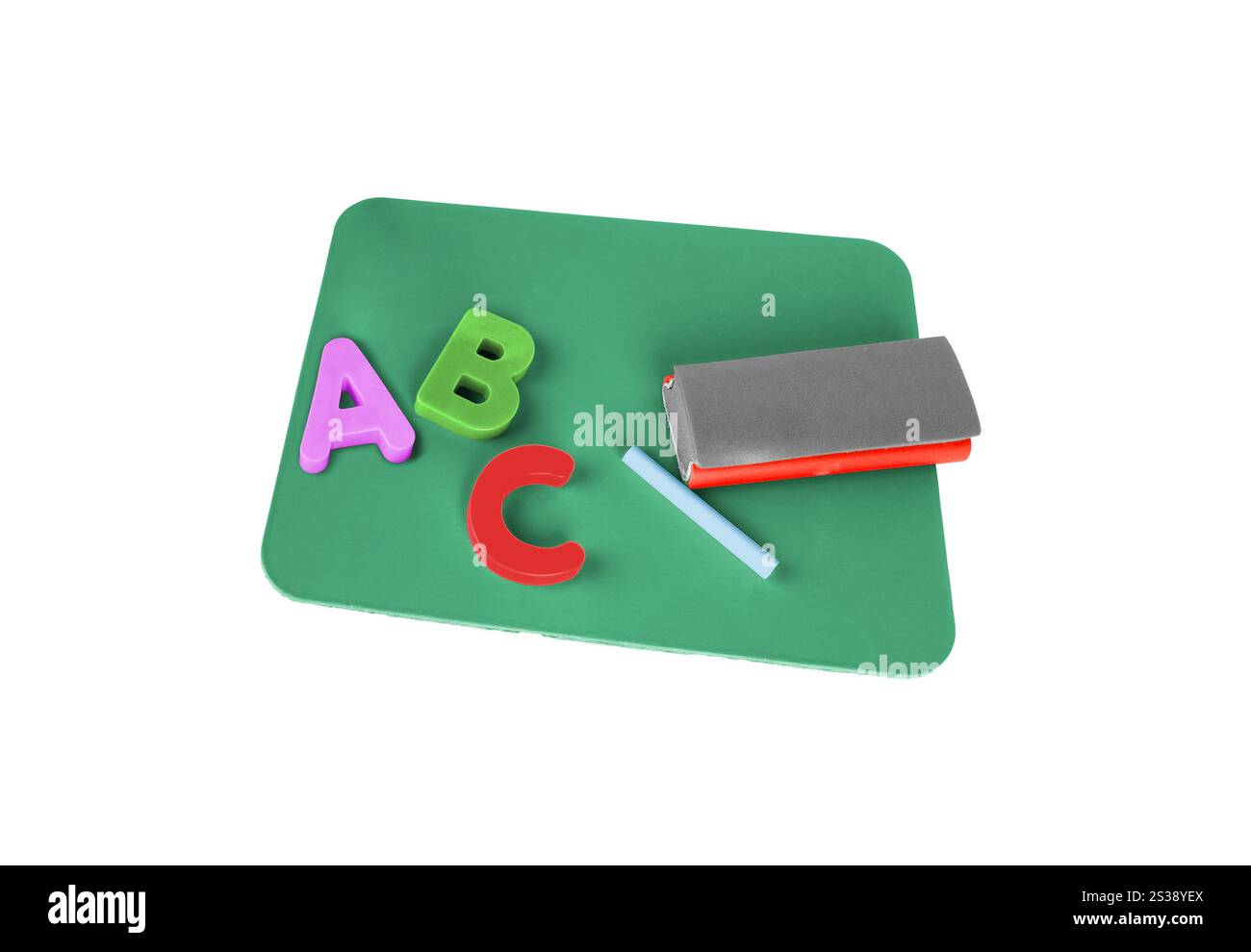 Colorful abc letters beside chalk and eraser on a small green ...