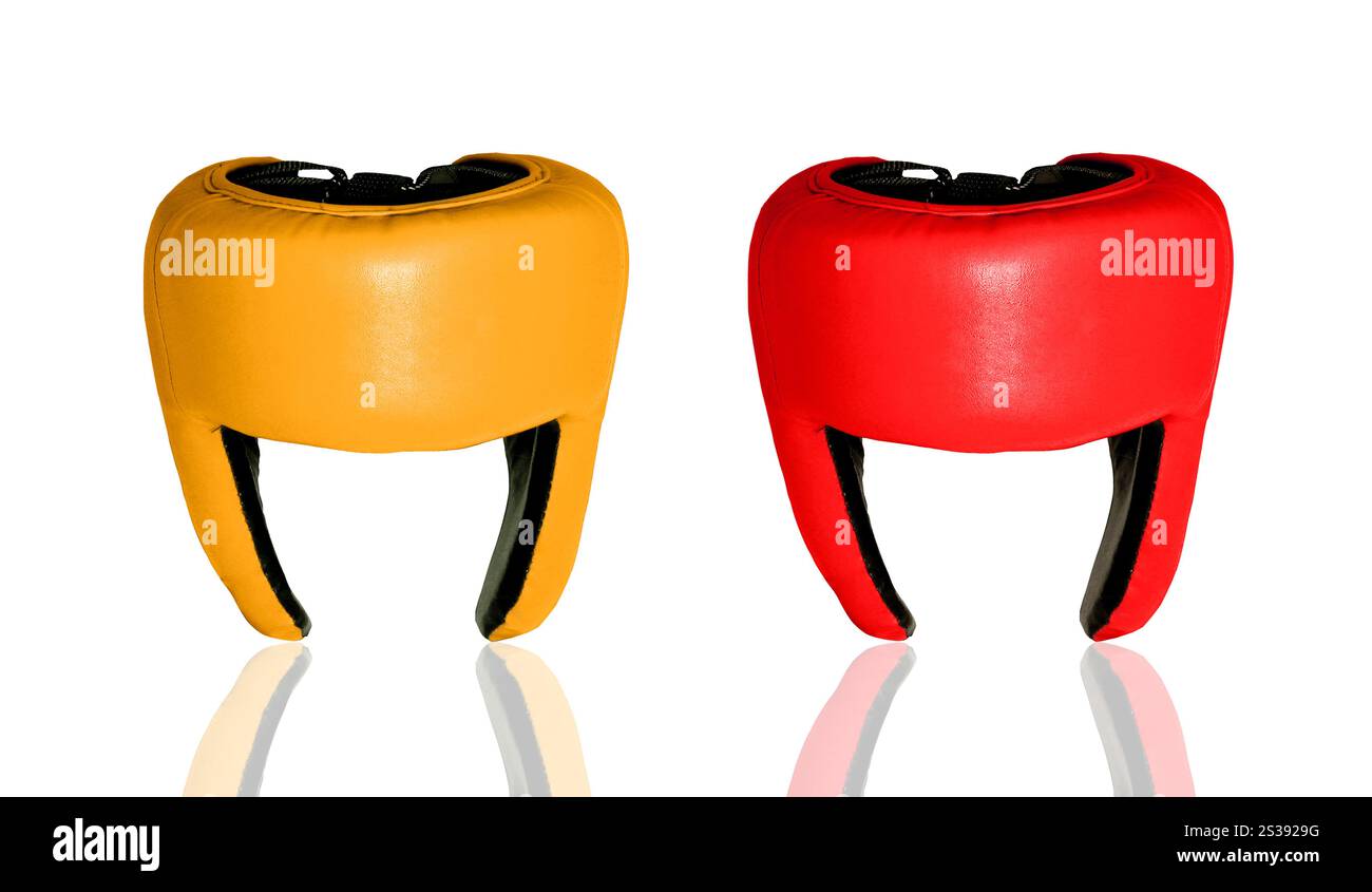 Yellow and red helmets on white background. Yellow and red helmets ...
