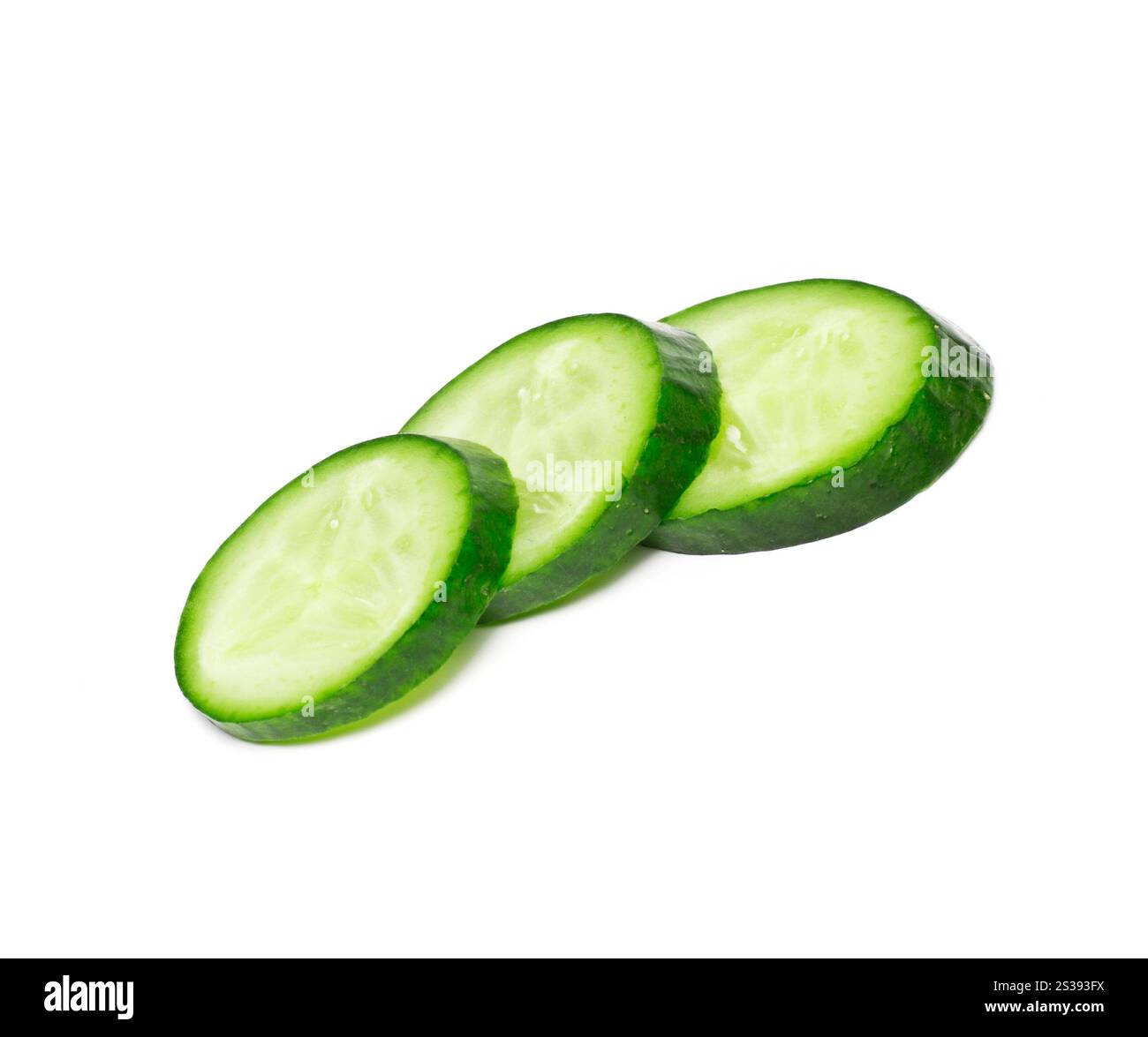 Cucumber slices background Cut Out Stock Images & Pictures - Alamy