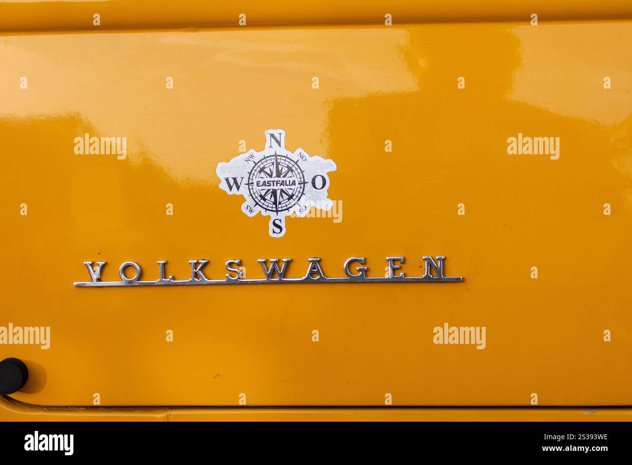 Volkswagen logo on yellow background Stock Photo - Alamy