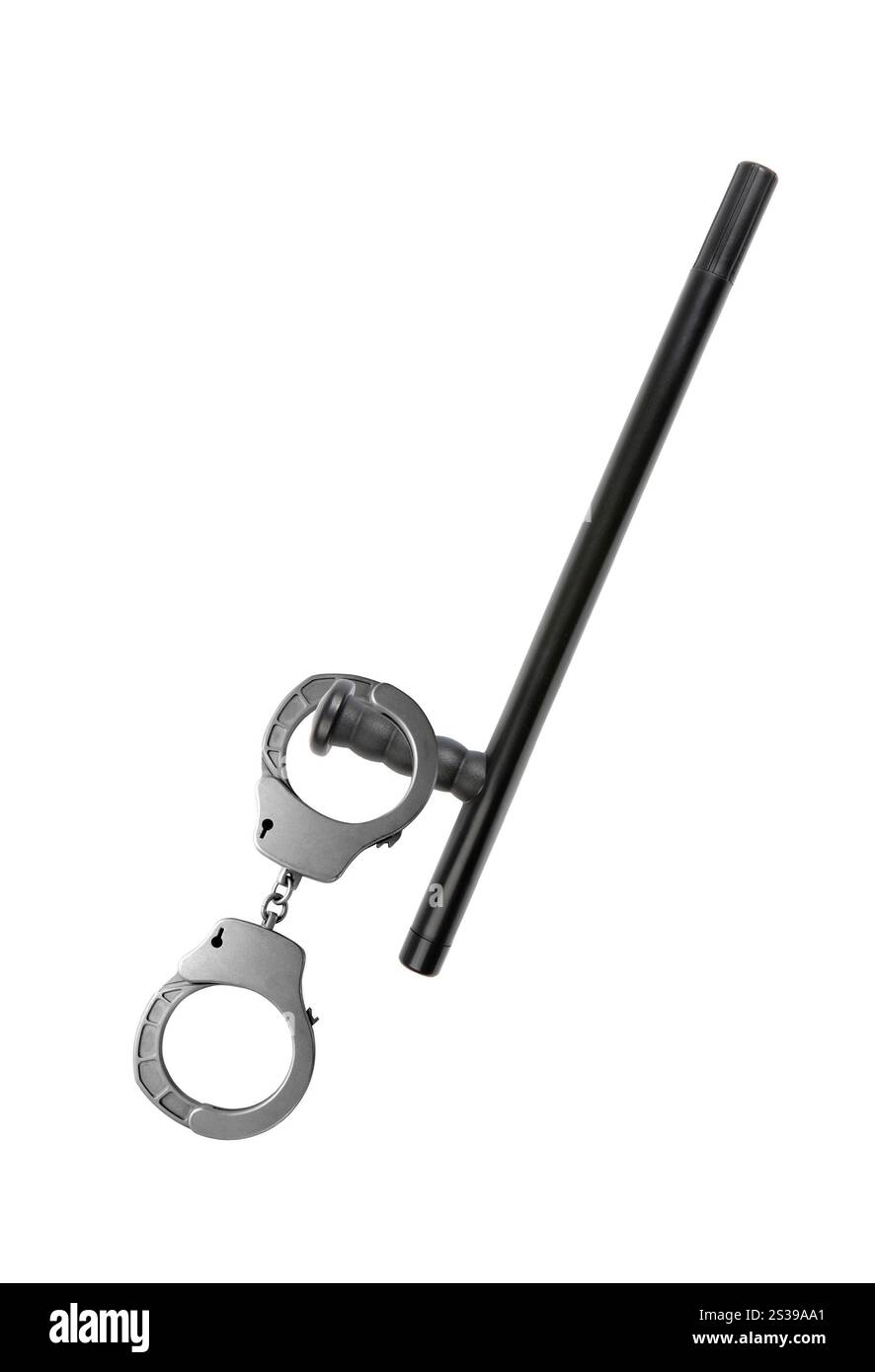 Rubber baton lying and handcuffs on a white background. Rubber baton ...