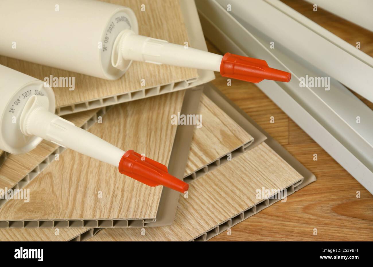 Set of items for PVC ceiling indoor works. Assembly adhesive bottles ...