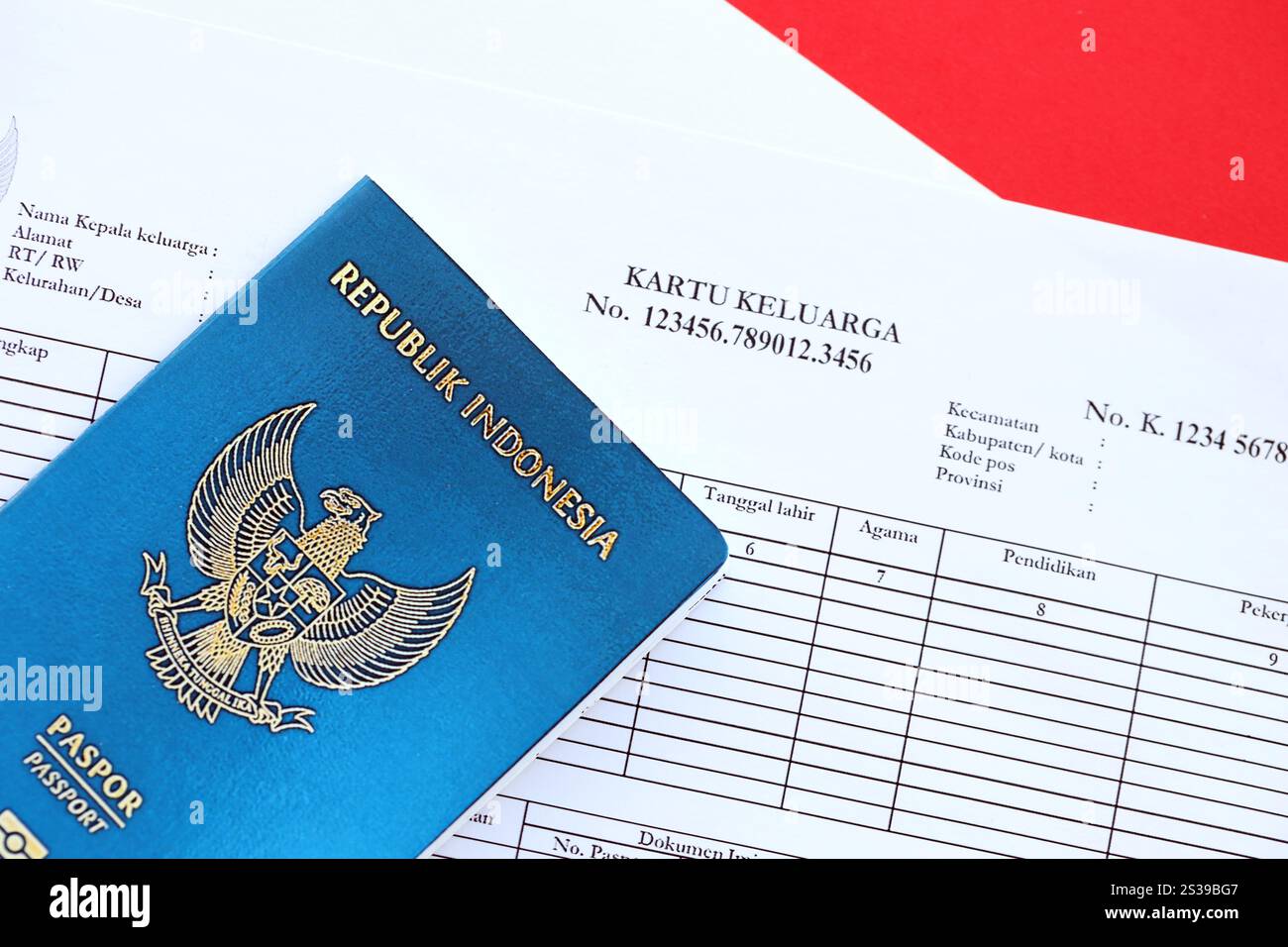 Kartu keluarga Family Identity Card with indonesian passport close up ...