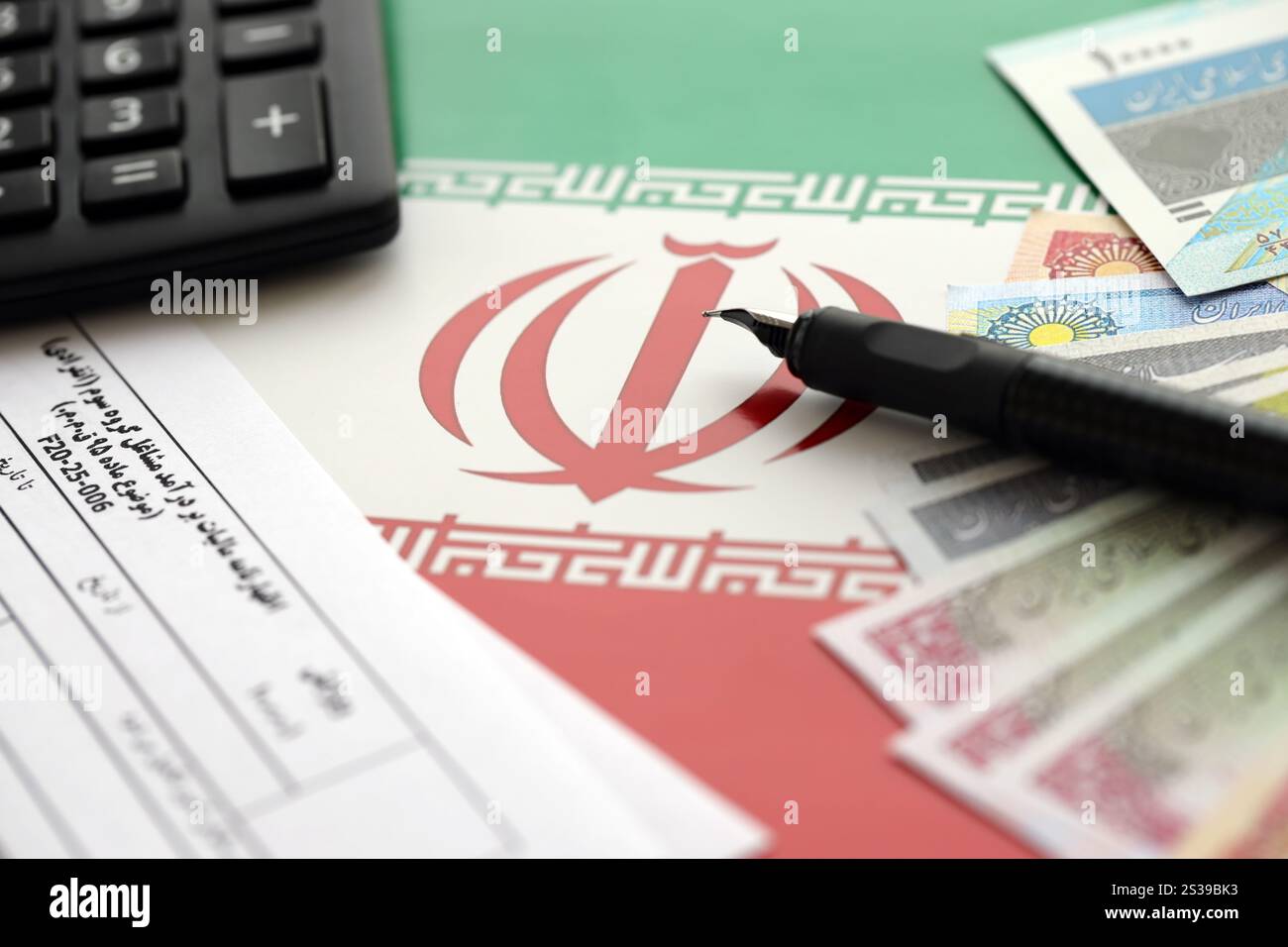 Iranian annual income tax return form F20-25-006 ready to fill on table ...