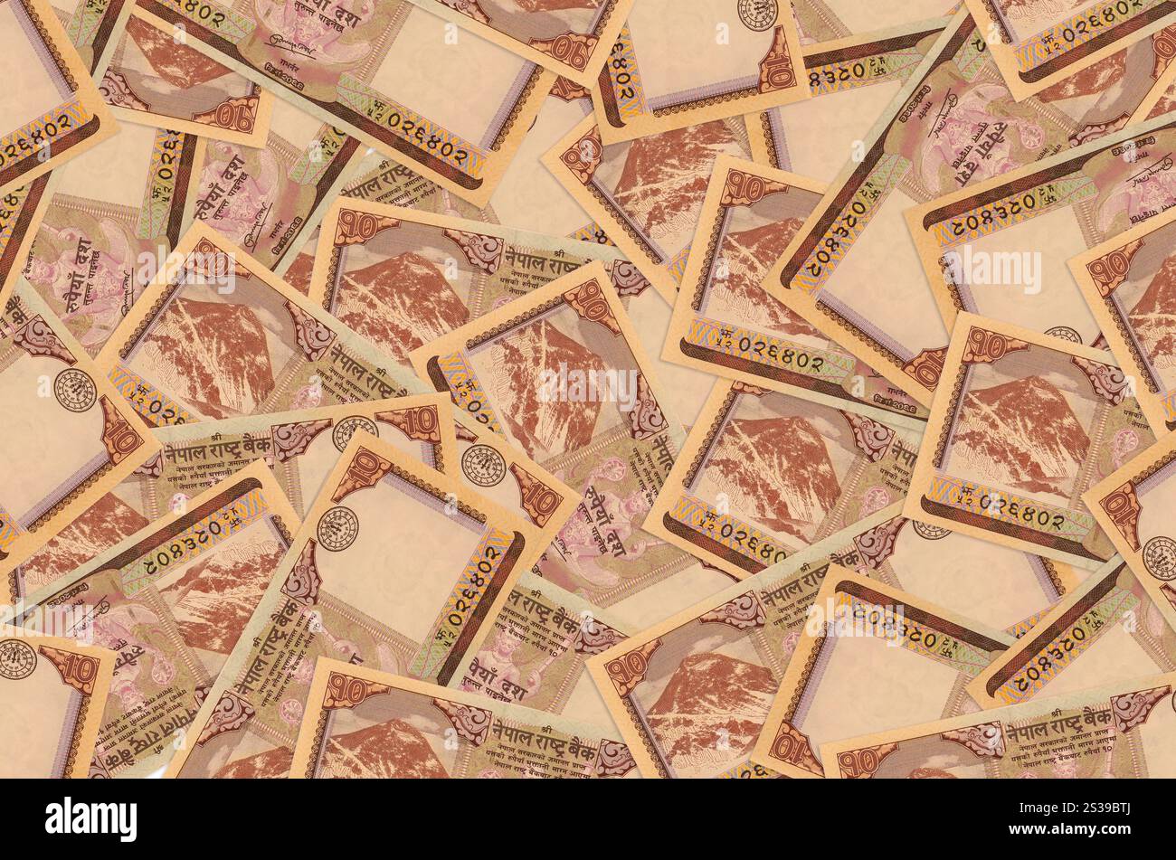 10 Nepalese rupees bills lies in big pile. Rich life conceptual ...