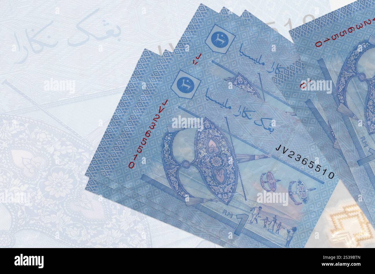 1 Malaysian ringgit bills lies in stack on background of big semi ...
