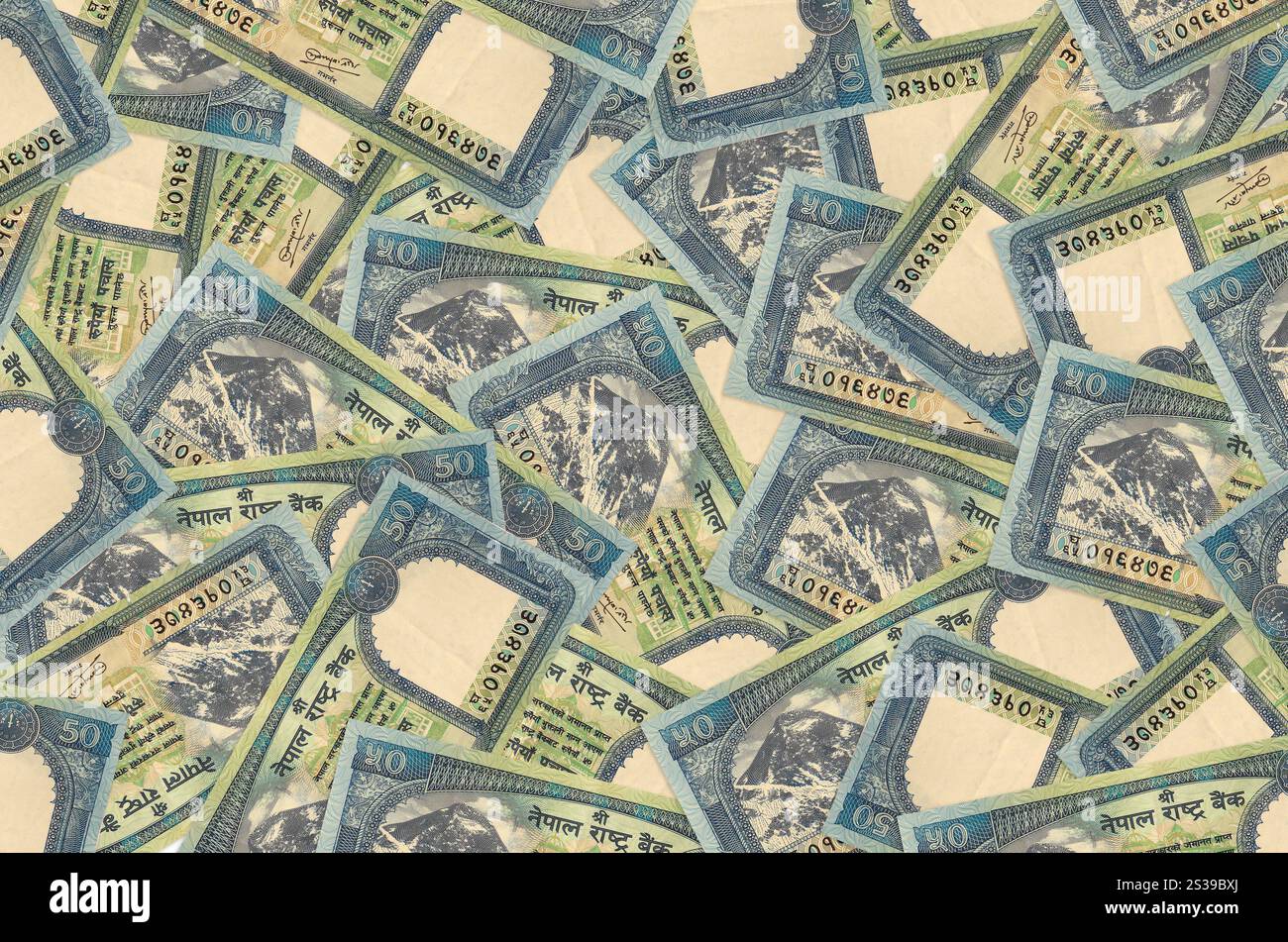 50 Nepalese rupees bills lies in big pile. Rich life conceptual ...