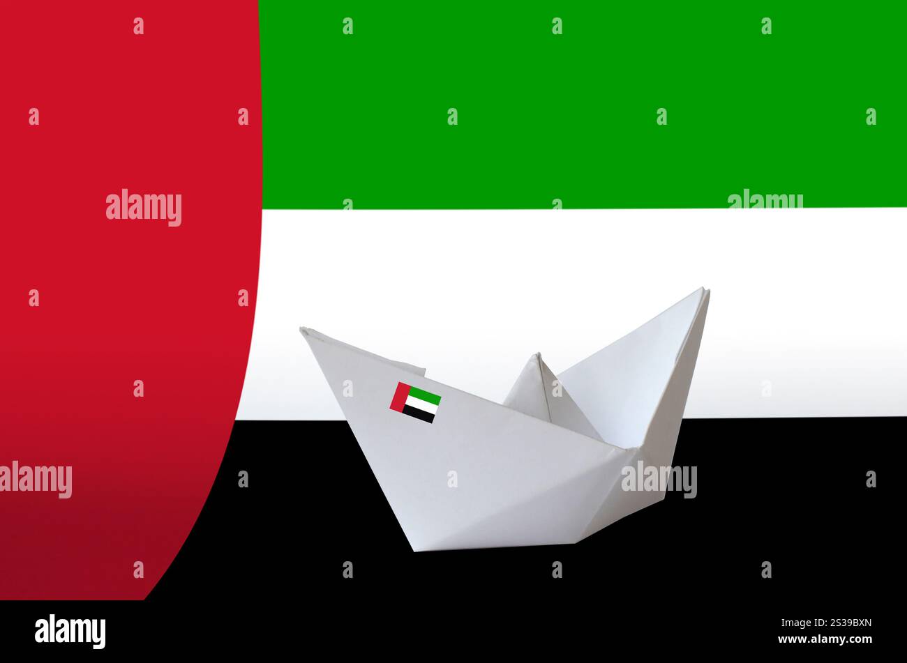 United Arab Emirates flag depicted on paper origami ship closeup ...