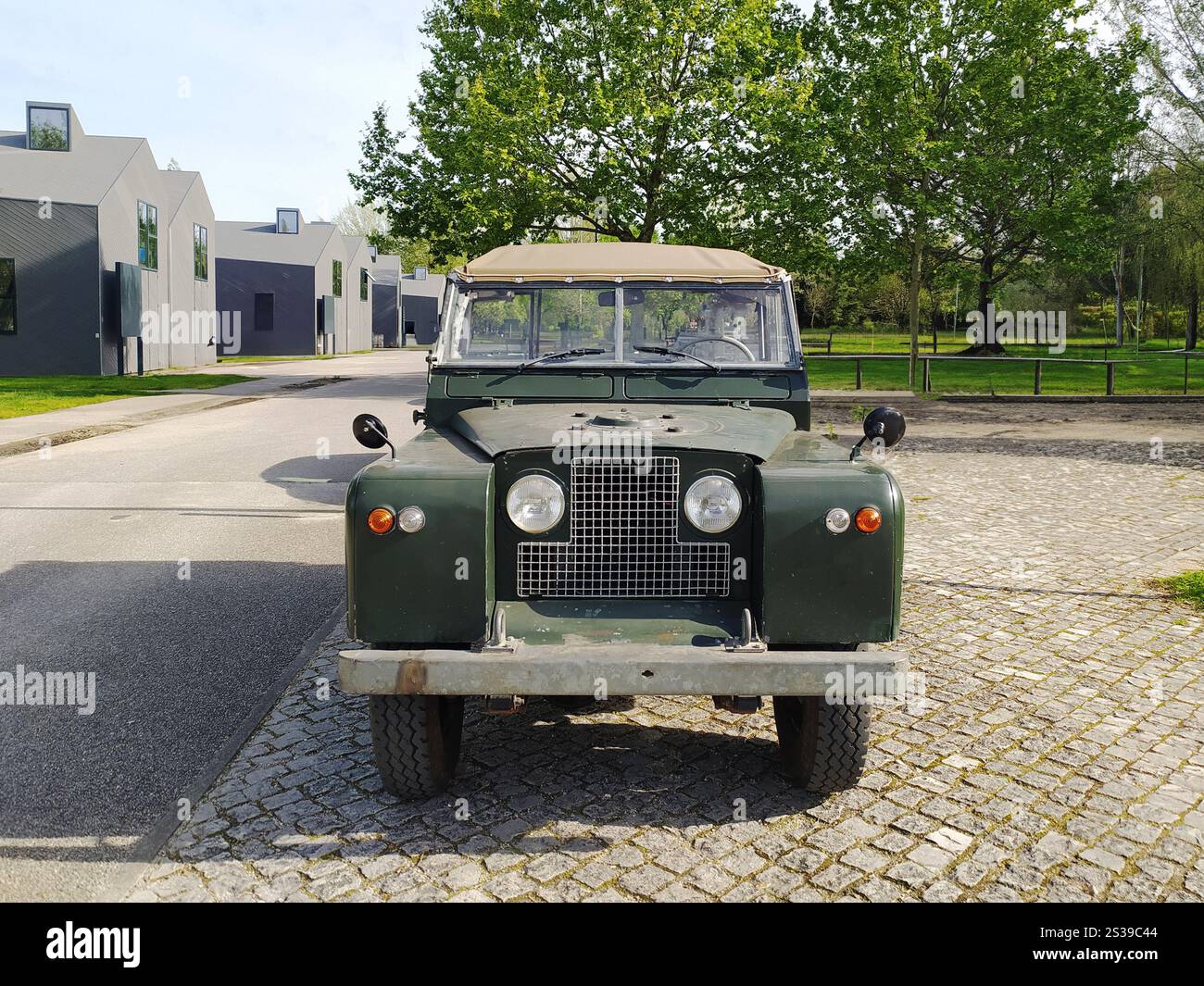 Green classic old SUV. Vintage car against the backdrop of nature ...