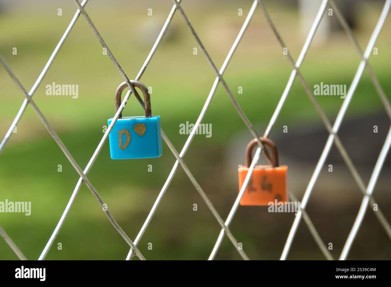 Love Padlock hanging on the fences of protection. Padlock key with love ...