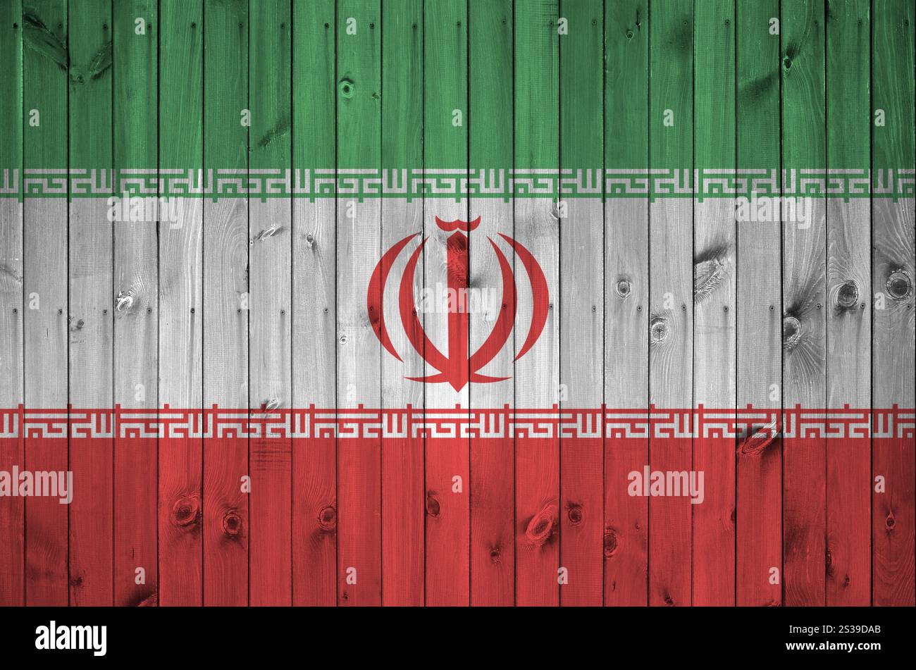 Iran flag depicted in bright paint colors on old wooden wall close up ...