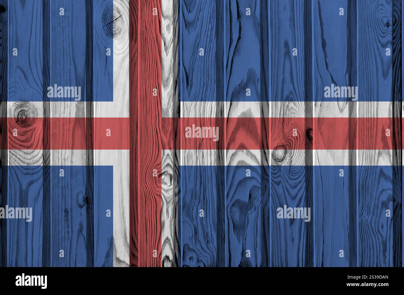 Iceland flag depicted in bright paint colors on old wooden wall close ...
