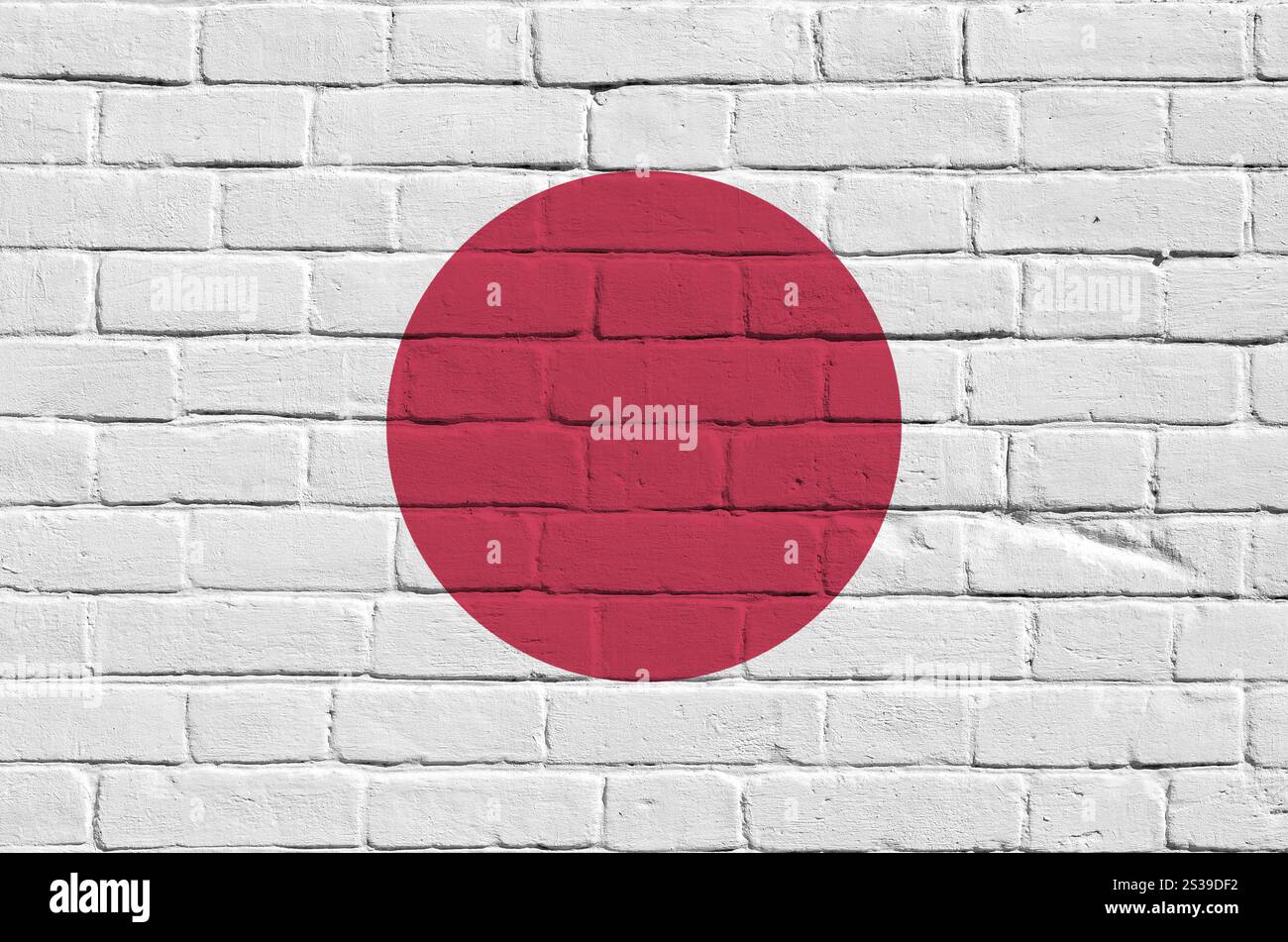 Japan flag depicted in paint colors on old brick wall close up ...