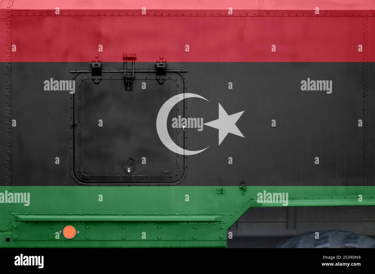 Libya flag depicted on side part of military armored truck close up ...