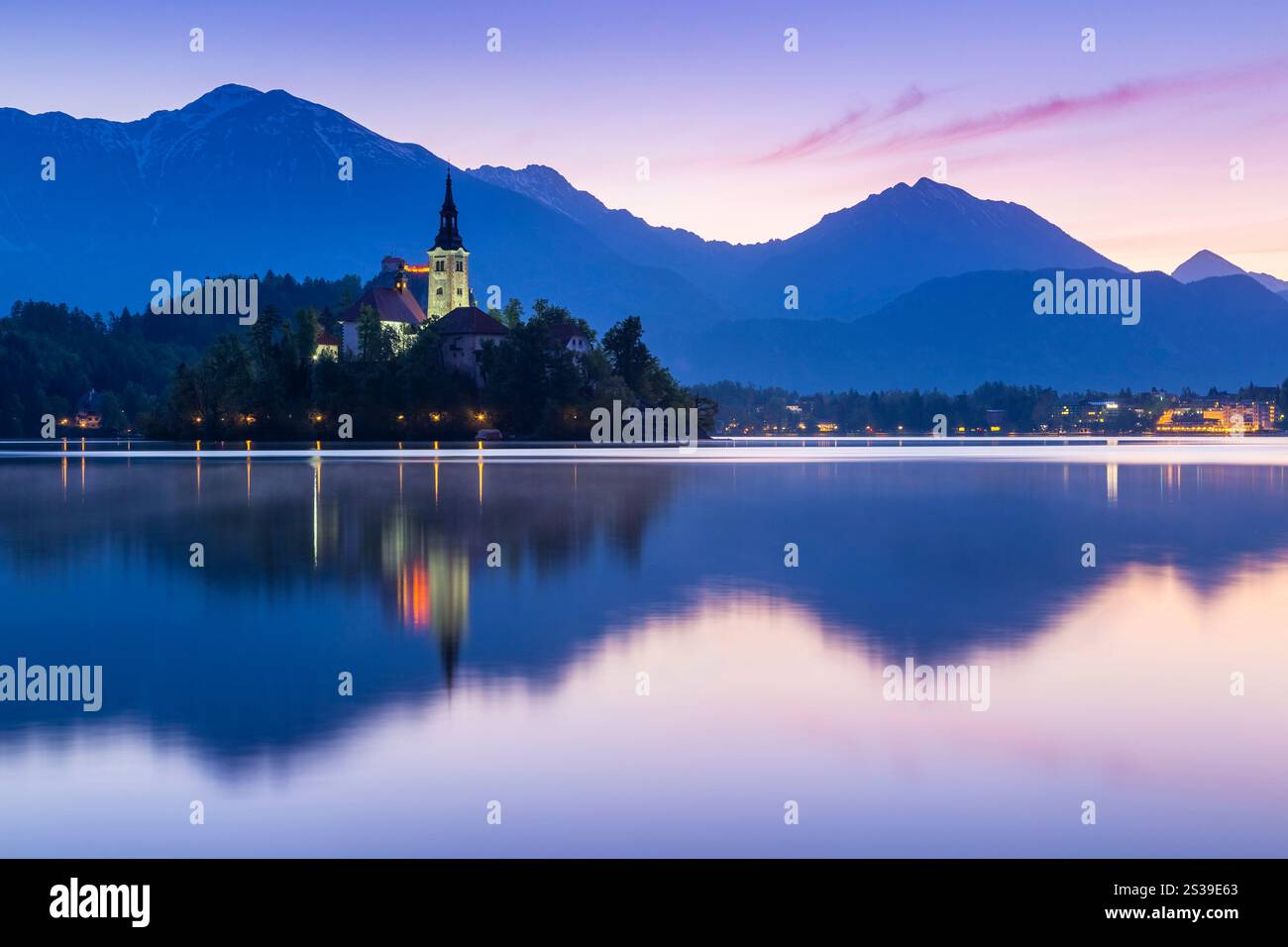 View of lake Bled at in spring with the small island and Assumption of ...